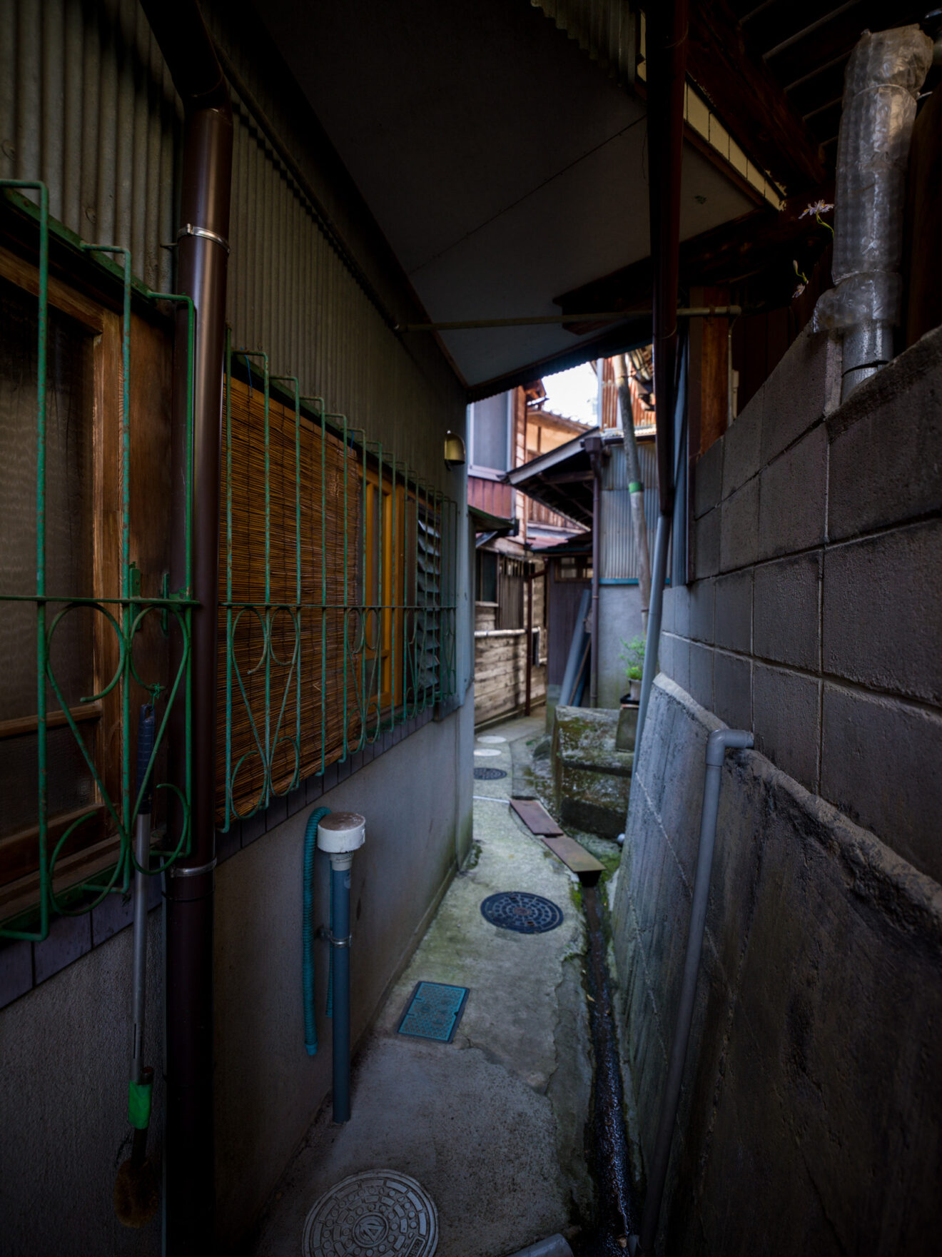 Weathered Industrial Alleyway: A Forgotten Passageway | Offbeat Japan